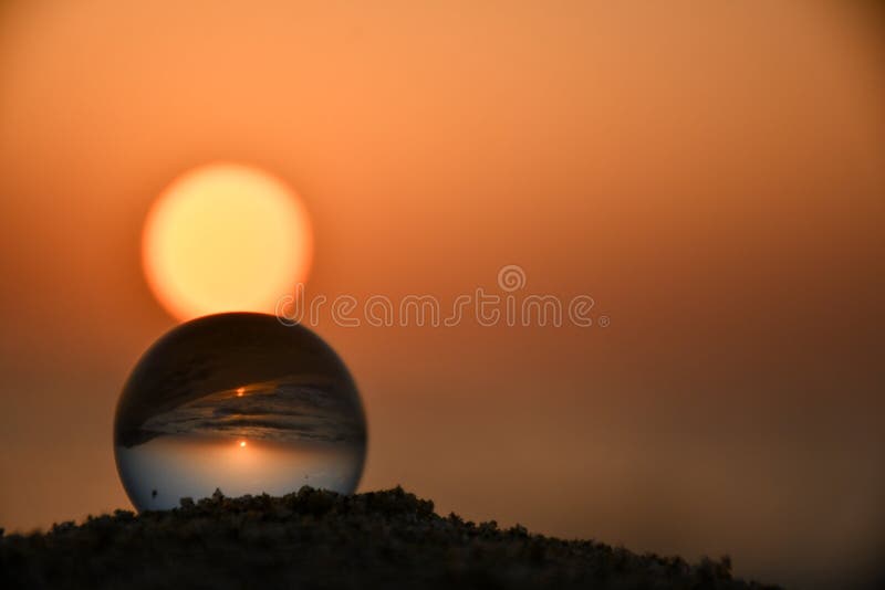 A sunset in a ball stock photo. Image of summer, beach - 227806556
