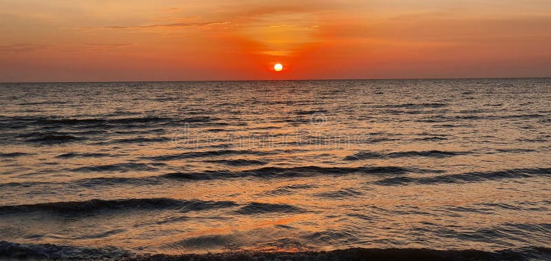 Sunset at batakan beach stock image. Image of family - 267138029