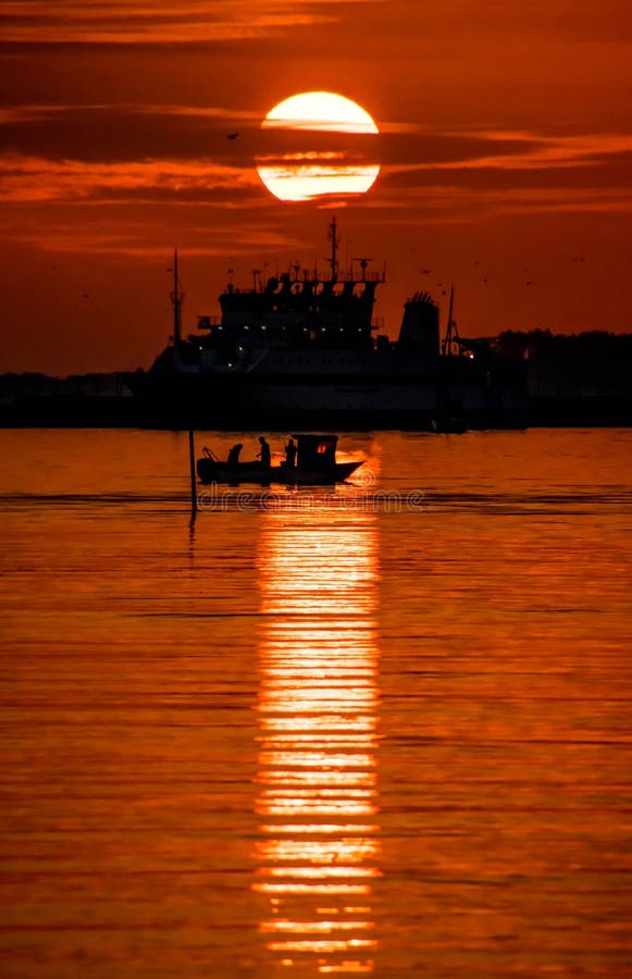 Sunset on the beach stock photo. Image of yellow, fishing - 126565622
