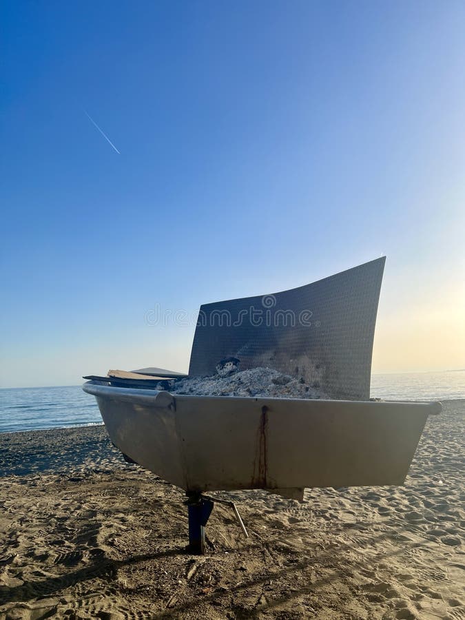 Sunset Beach with Ash-Filled Firepit Stock Image - Image of scene ...