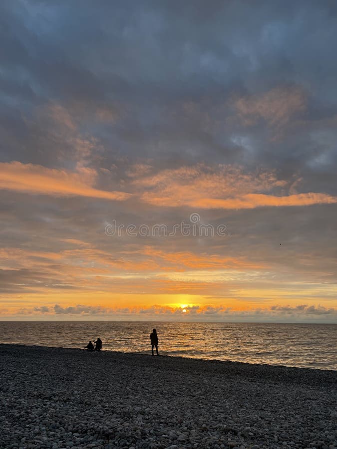 Sunset on the beach stock photo. Image of sunrise, shore - 265825076