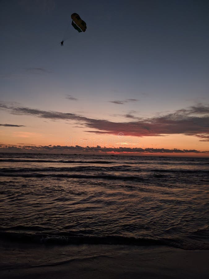 Sunset at the Beach. Beautiful Sky with Clouds. Parachute High Up in ...