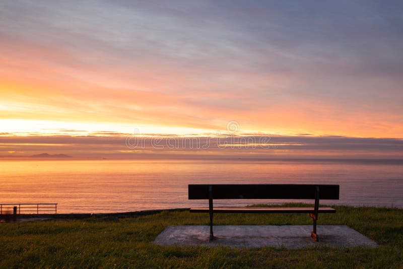 Sunset beach and bench. stock image. Image of ocean - 185881759