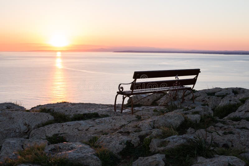 Beach bench at sunset stock image. Image of dunes, warm - 579511