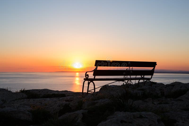 Sunset beach and bench stock image. Image of nature, beautiful - 90715189
