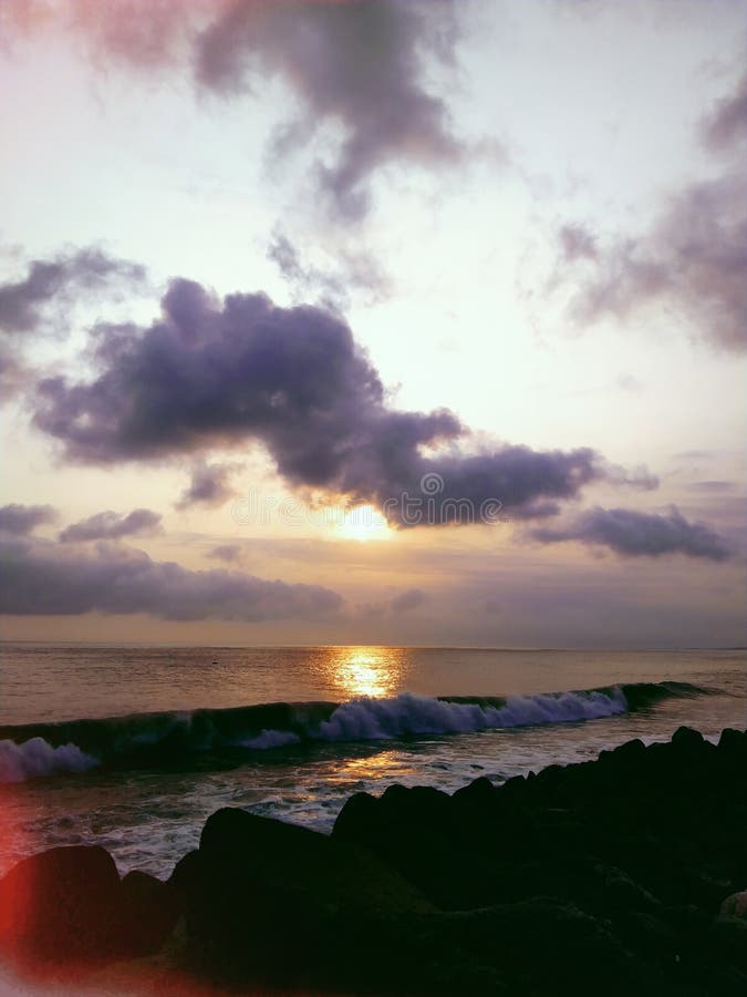 Sunset on the Beach , Black Coulds, Backround Stock Photo - Image of ...