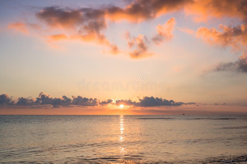 Sunset on the Beach with Clouds Stock Photo - Image of gold, scenery ...