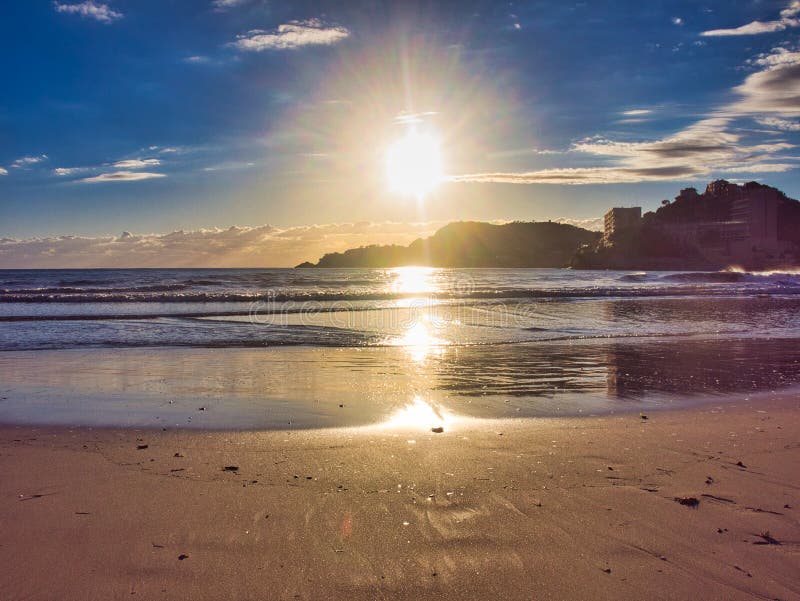 Sunset at the Beach with Some Water Reflections from the Sun Stock ...