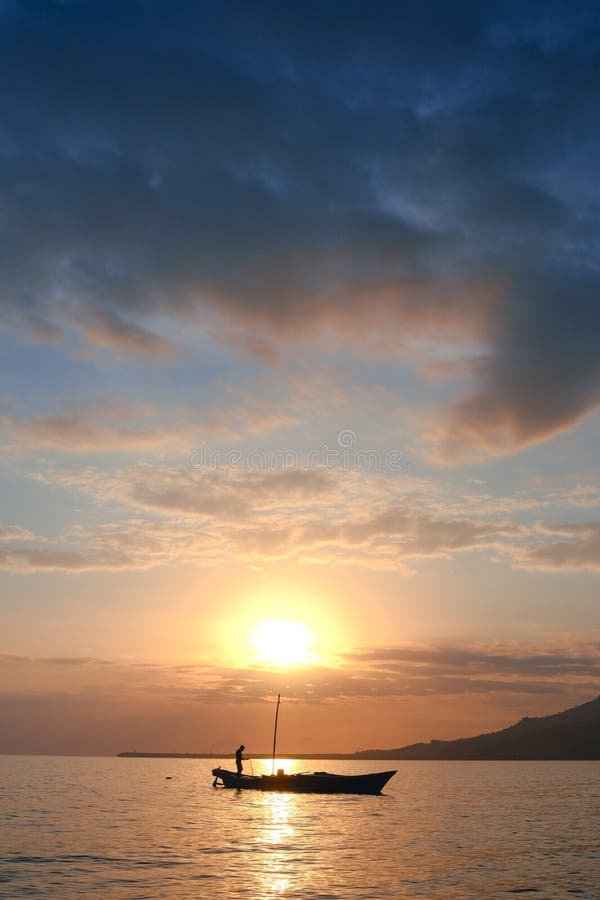 Sunset on the Beach Indonesia Stock Image - Image of nelayan, beach ...