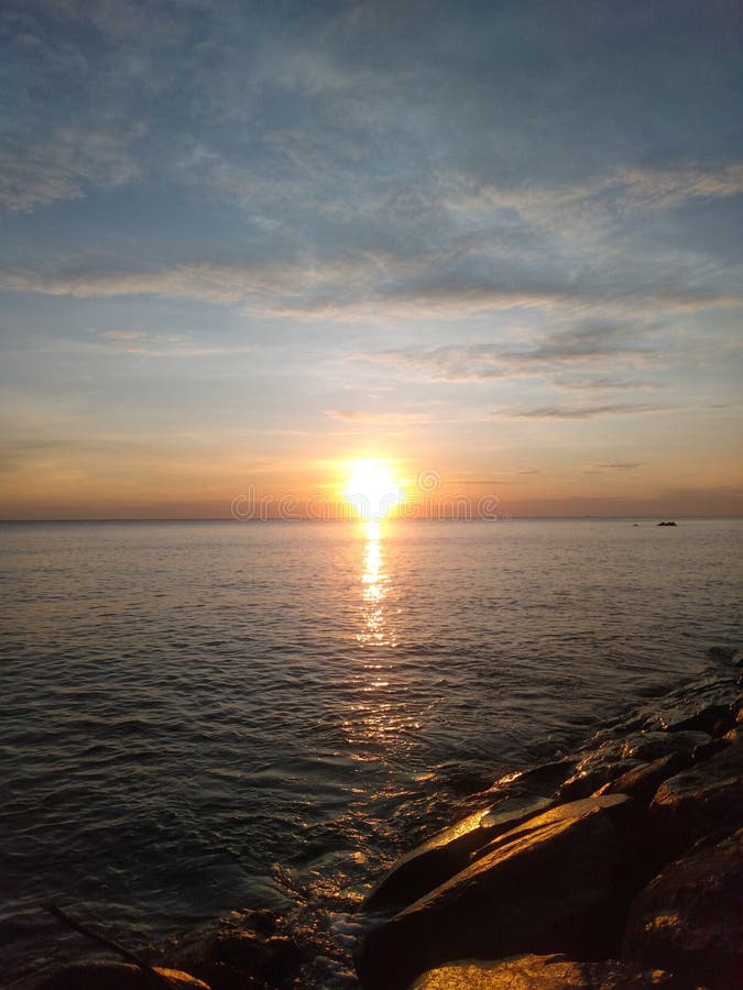 Sunset on a Beach in Indonesia, the Water is Very Clear and Very ...