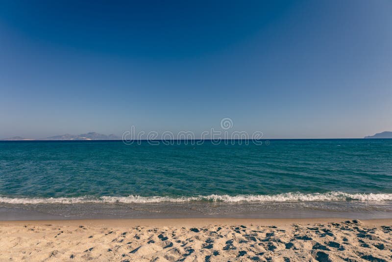 Sunset at the beach in kos stock photo. Image of building - 251891038