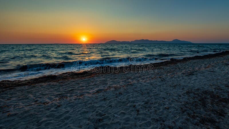 Sunset at the beach in kos stock photo. Image of beauty - 286345598