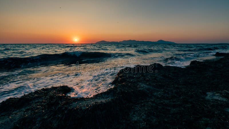 Sunset at the beach in kos stock image. Image of coast - 313761803