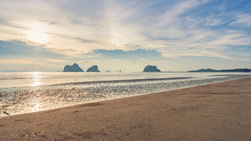 Sunset on the Beach with Mountain Background. Stock Photo - Image of ...