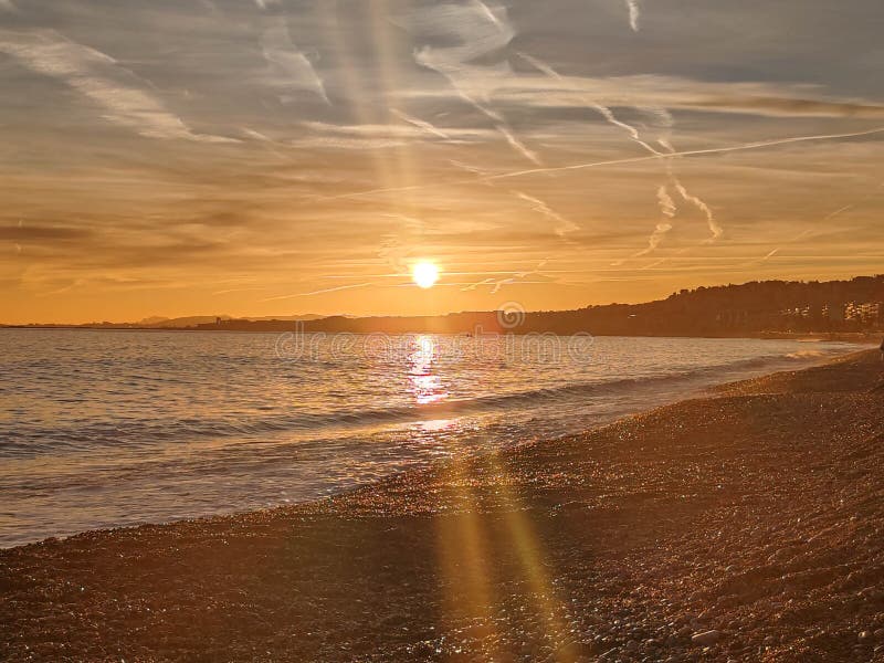 Sunset on the Beach in Nice, France Stock Photo - Image of glow ...