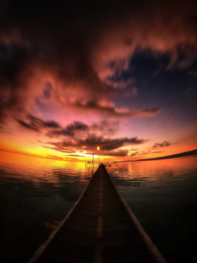 Sunset on the Beach with Orange Heavy Sky Stock Photo - Image of heavy ...