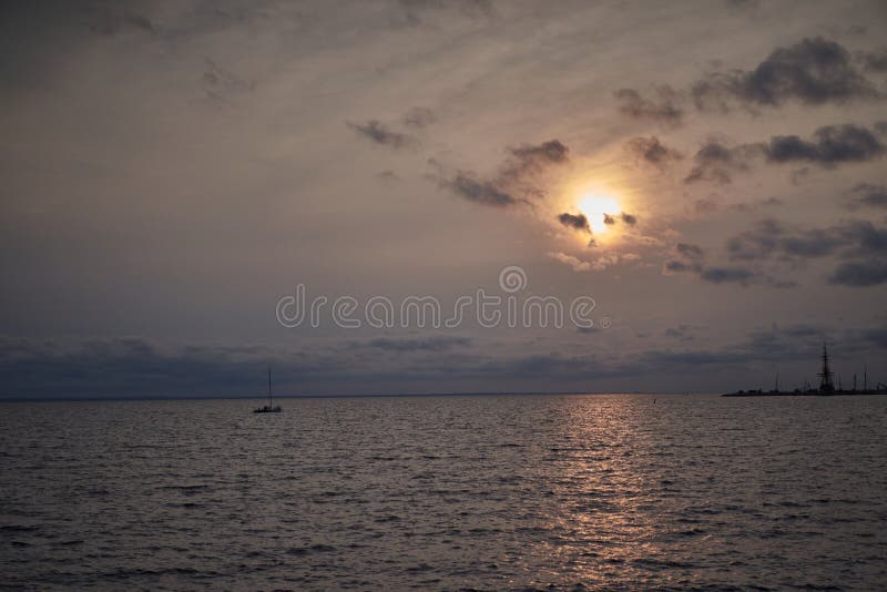 Sunset on the Beach with Orange Sun and Glare on the Water Stock Image ...