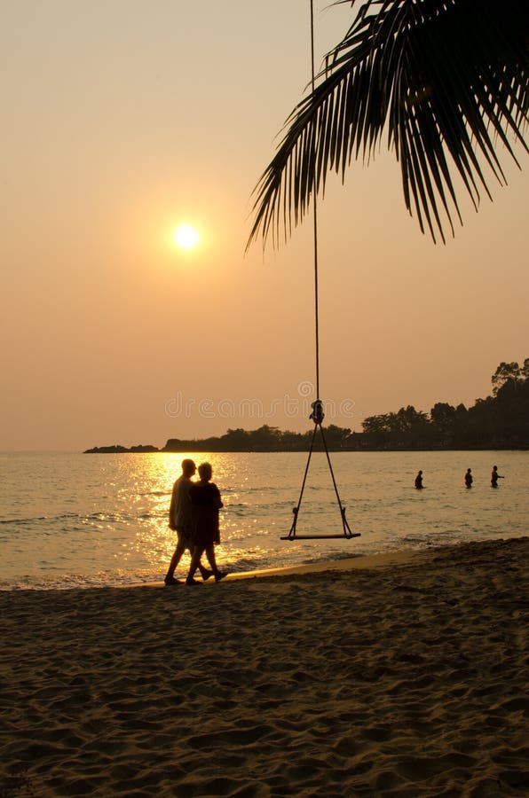 Sunset at the beach stock photo. Image of sunset, lovers - 61651224