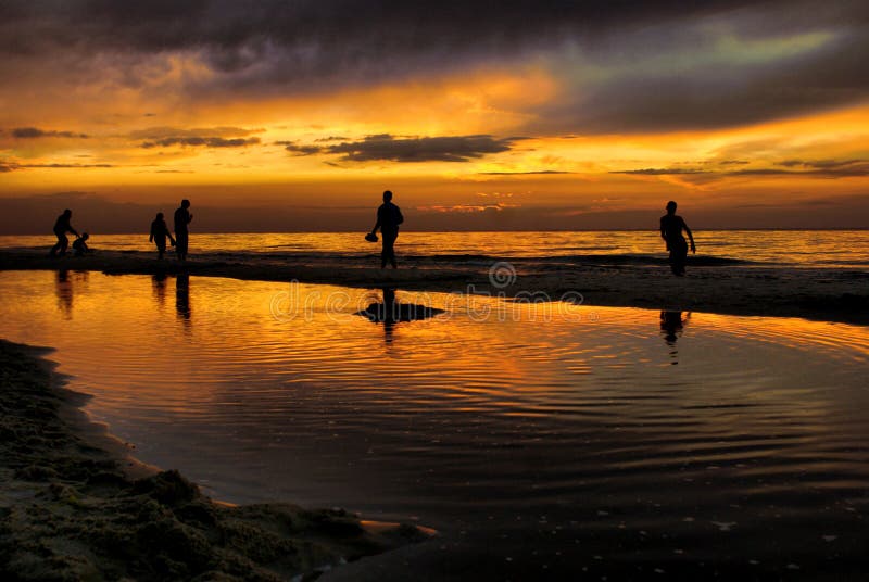 Sunset beach stock photo. Image of reflection, holidays - 86674496