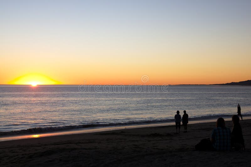 Sunset at Beach with People Watching Editorial Photography - Image of ...