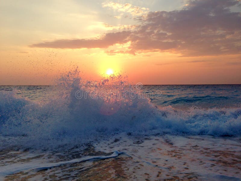 Sunset at beach stock image. Image of afterglow, sunlight - 64678469