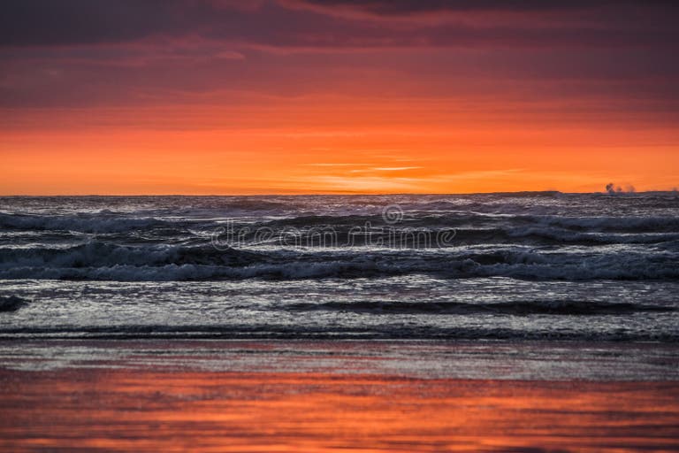 Sunset at the Beach with Reflection of Colorful Light Stock Photo ...