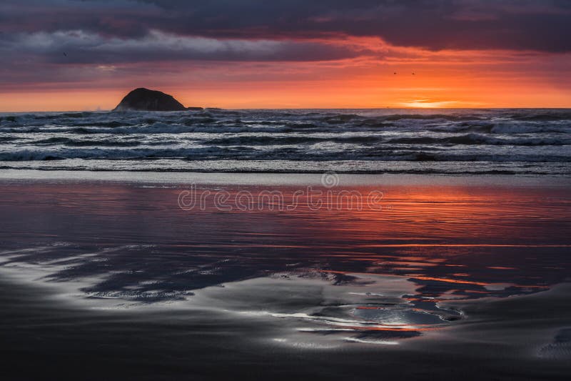 Sunset at the Beach with Reflection of Colorful Light Stock Photo ...