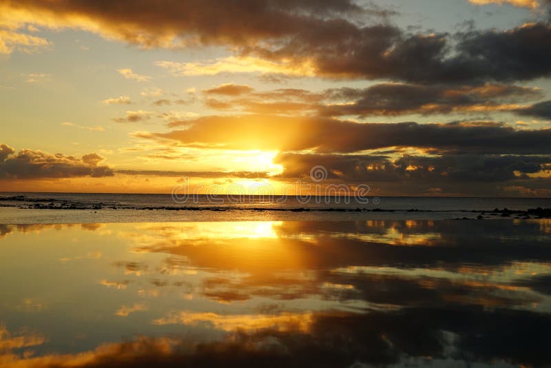 Sunset by a Tropical Beach and Its Reflection on the Water of an ...
