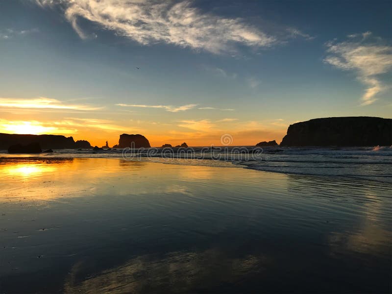 Sunset Beach, Reflections, and Clouds Stock Photo - Image of angle ...