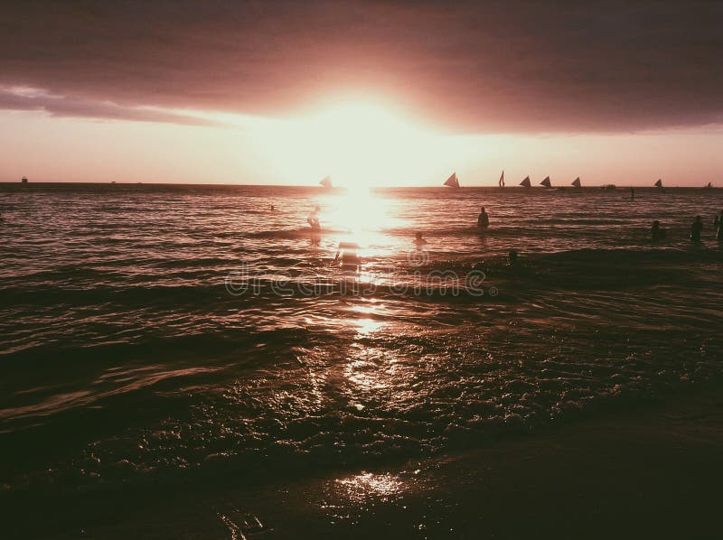 Sunset at the beach stock photo. Image of vsco, wave - 97354800