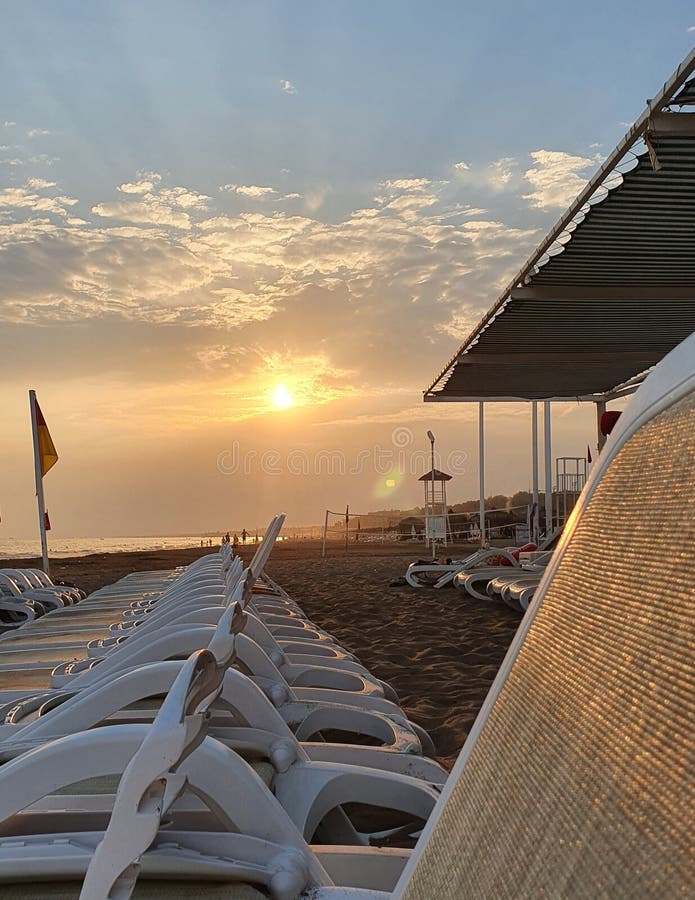 Sunset on the Beach, Rest on Deckchairs Stock Image - Image of dusk ...