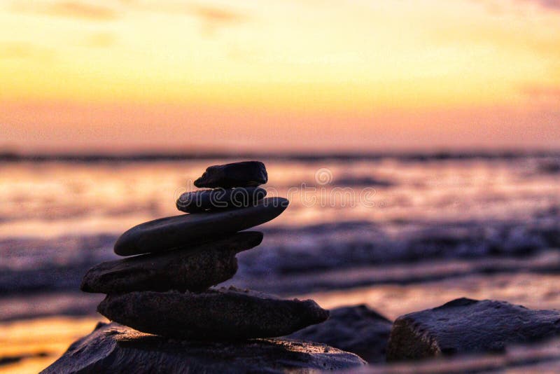 Sunset on the beach stock photo. Image of ontop, rock - 106427582