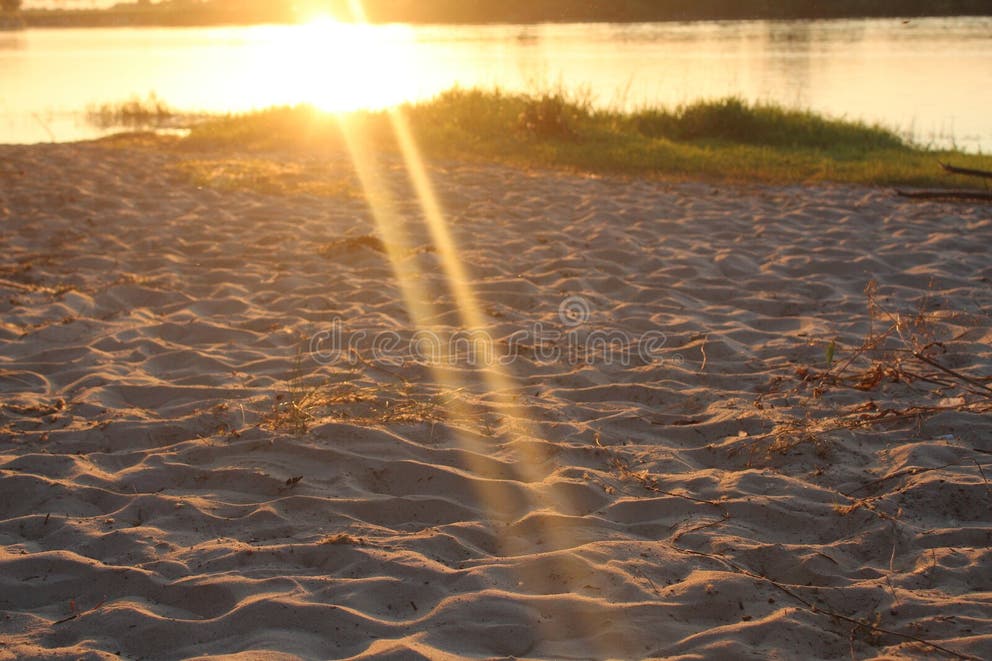 Sunset on the Beach. Sand on the Beach in the Sunset Light Evening on ...