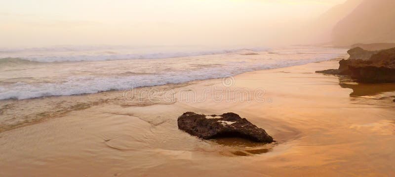 Sunset Beach stock image. Image of waves, beach, rocks - 92105039