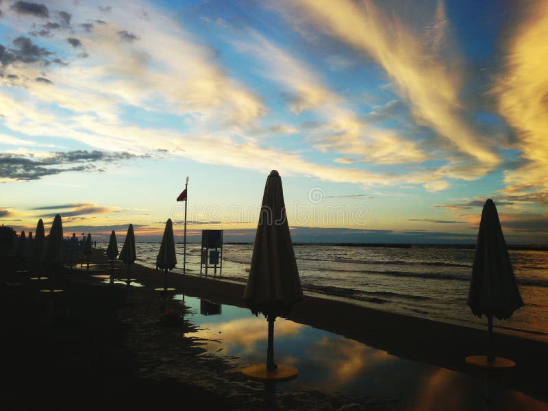 Sunset and beach stock image. Image of shadow, sunset - 109912193