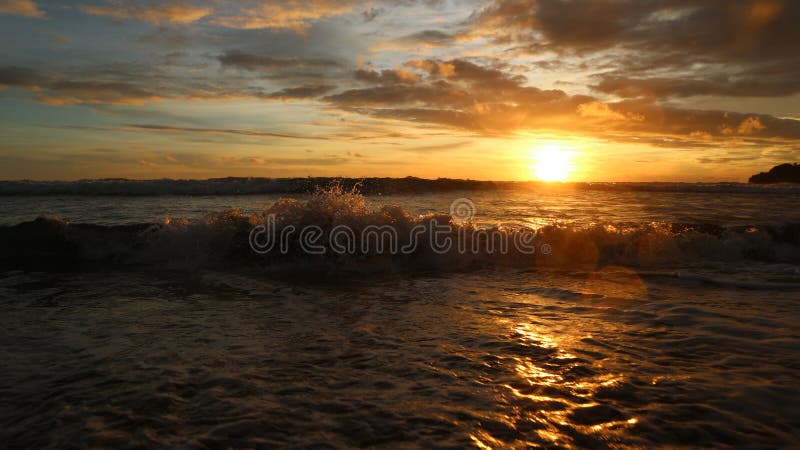 Sunset at the Beach with Small Waves Stock Image - Image of waves ...