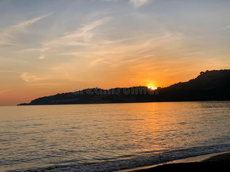Sunset on the Beach the Sun is almost Out of Sight Stock Image - Image ...