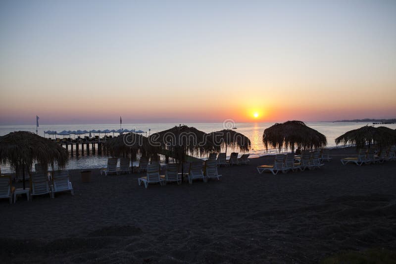 Sunset on the beach. stock image. Image of umbrella - 192200417