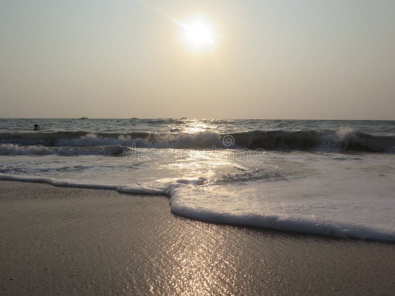 Sunset on the beach stock photo. Image of sunrise, orange - 185992146
