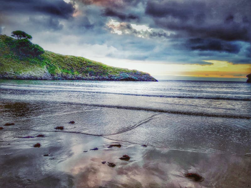 Sunset at the beach stock image. Image of purity, tranquility - 228752923