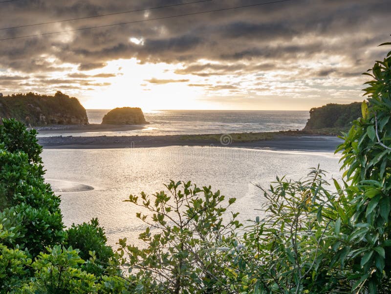 Sunset at the Beach through the Trees Stock Image - Image of beach ...