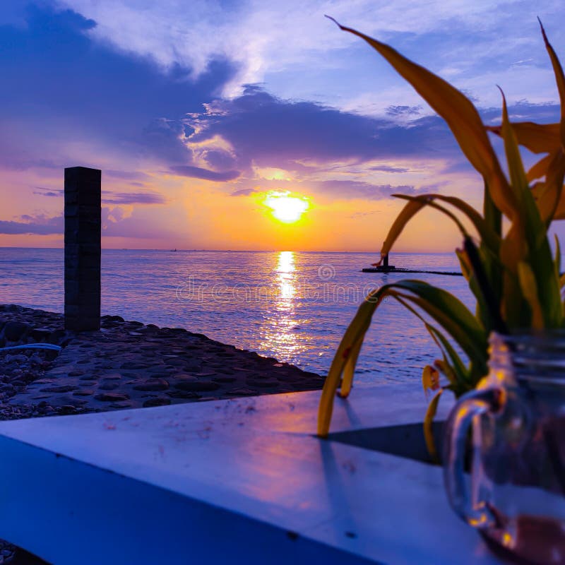 Sunset at beach utama raya stock photo. Image of dusk - 261879936