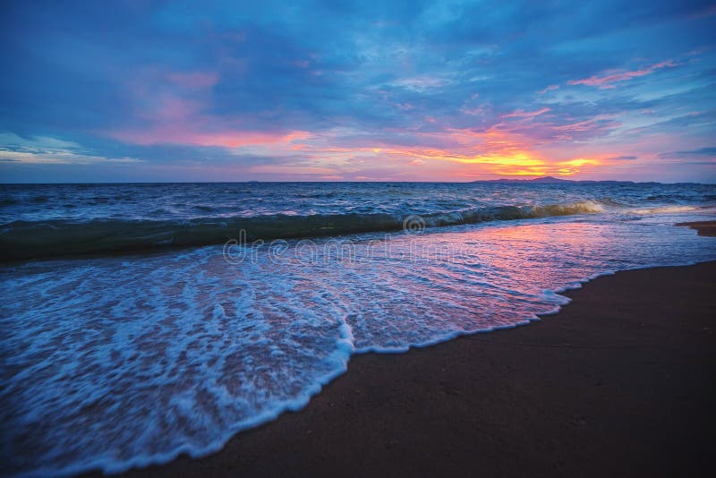Sunset on the Beach. Beach with Waves at Dusk Stock Photo - Image of ...