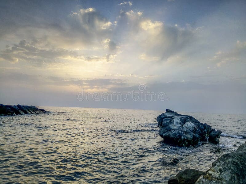 The sunset beams stock photo. Image of calmsea, beams - 129002182