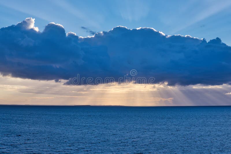 Sunset Beams Surround Huge Cloud Stock Image - Image of scenery ...