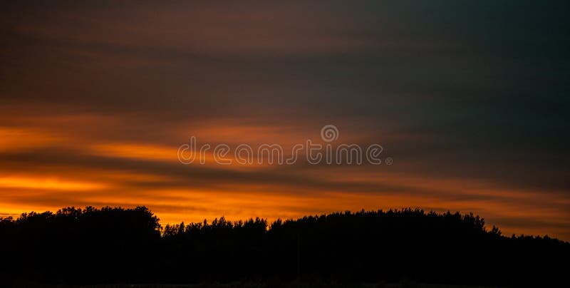 Sunset with Beautiful Cloudy Sky and Treeline Stock Image - Image of ...