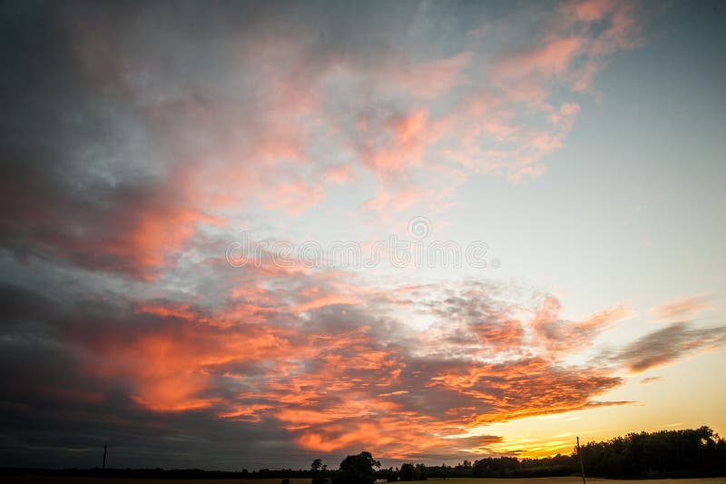 Sunset with Beautiful Cloudy Sky and Treeline Stock Photo - Image of ...