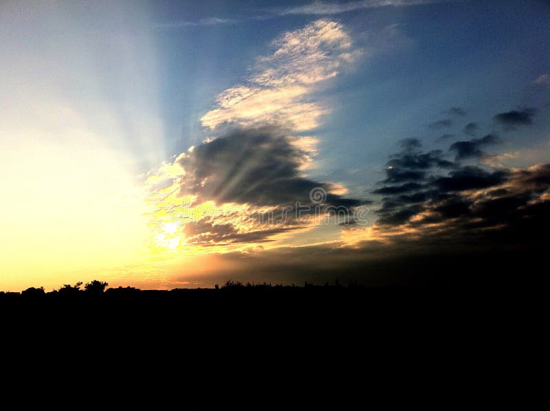 Sunset with Beautiful Colors of Sky and Clouds, Sunrays Stock Image ...