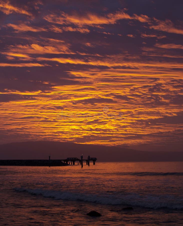 Sunset. stock image. Image of fire, dock, sunset, water - 62568419