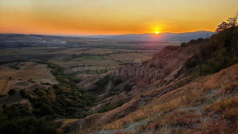 Of Sunset with a Beautiful Overlooking View of a Field Stock Photo ...
